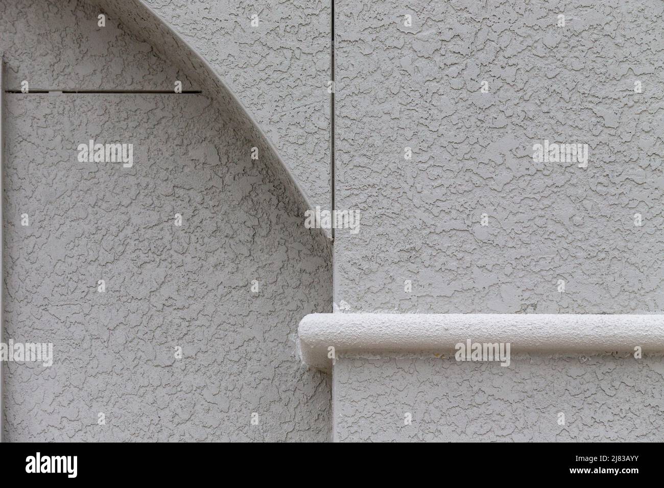 Applied Stucco on outside wall with arch and lip including drain lines ...