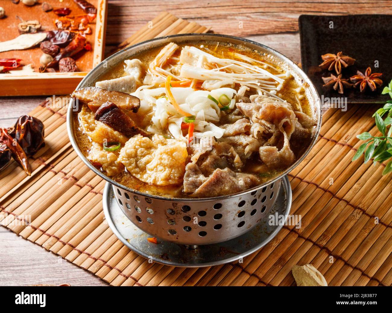 beef hot pot stew with red chili isolated on mat side view of japanese ...
