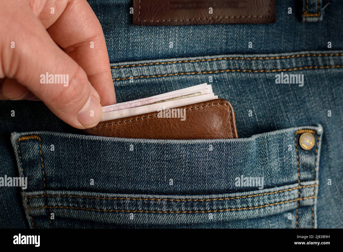 Money woman back pocket hi-res stock photography and images - Alamy