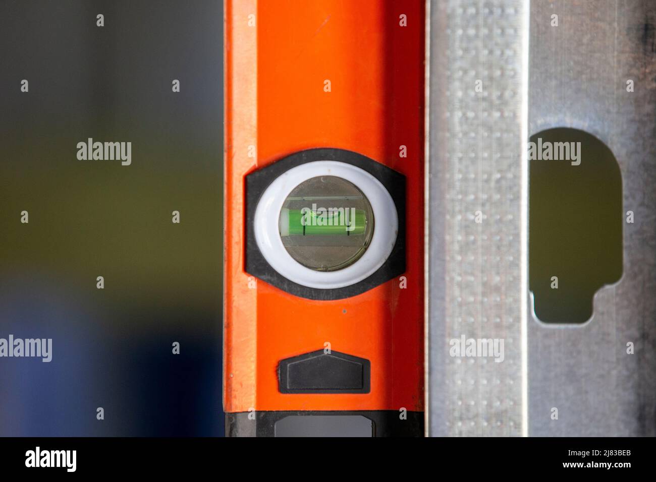 Construction level used vertically to measure the galvanized steel ...