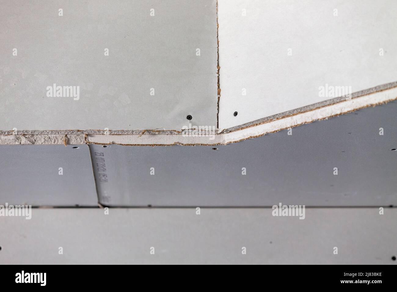 Tricky Drywall Installation with a lip an an overhead corner Stock ...