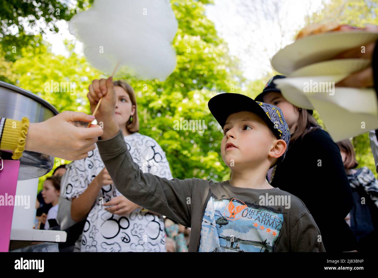 A Ukrainian child gets cotton candy during a party at Palace of ...