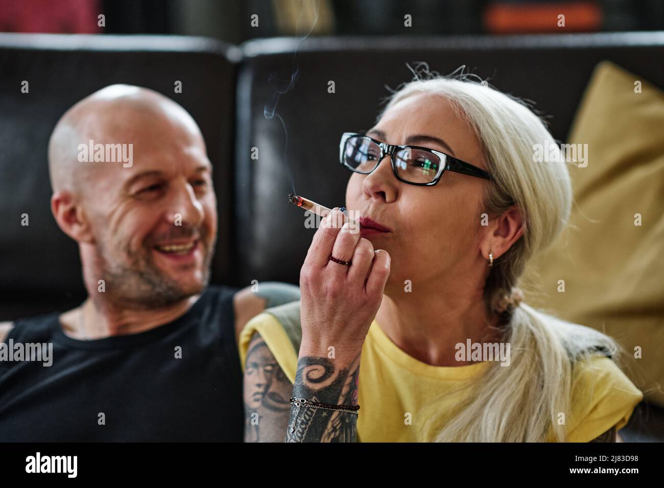 Selective focus shot of mature Caucasian woman with long gray hair and ...