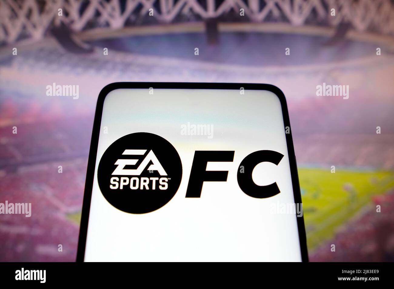 In this photo illustration, the EA Sports FC logo seen displayed on a ...