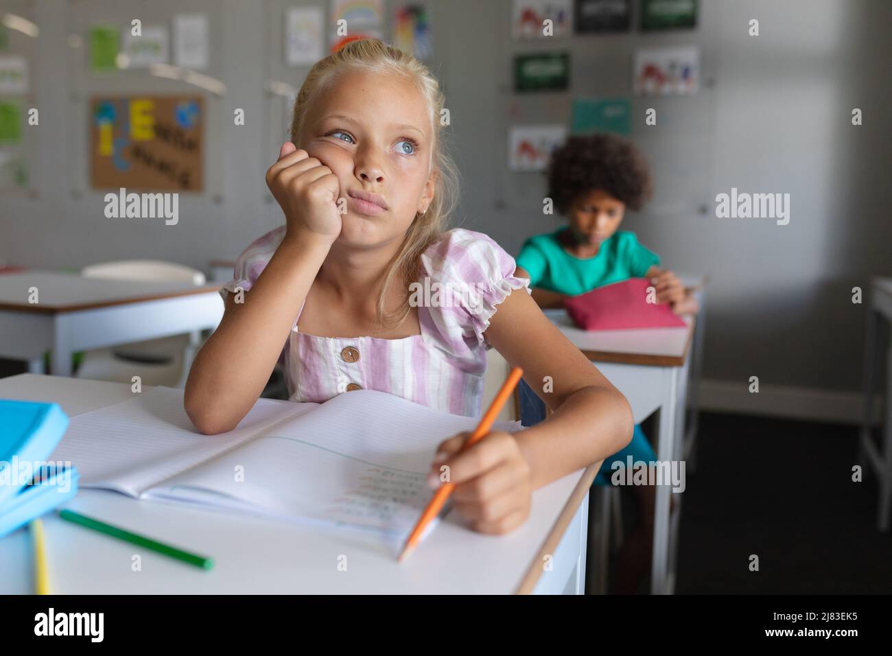 Student hand with pencil on desk hi-res stock photography and images ...