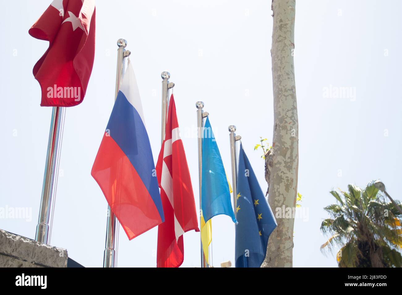 Flags of different countries at the entrance Stock Photo - Alamy