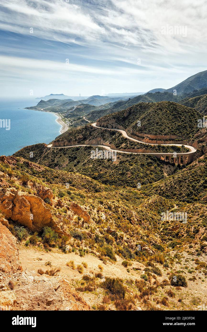 View from La Granatilla viewpoint of winding coastal road and viaduct ...