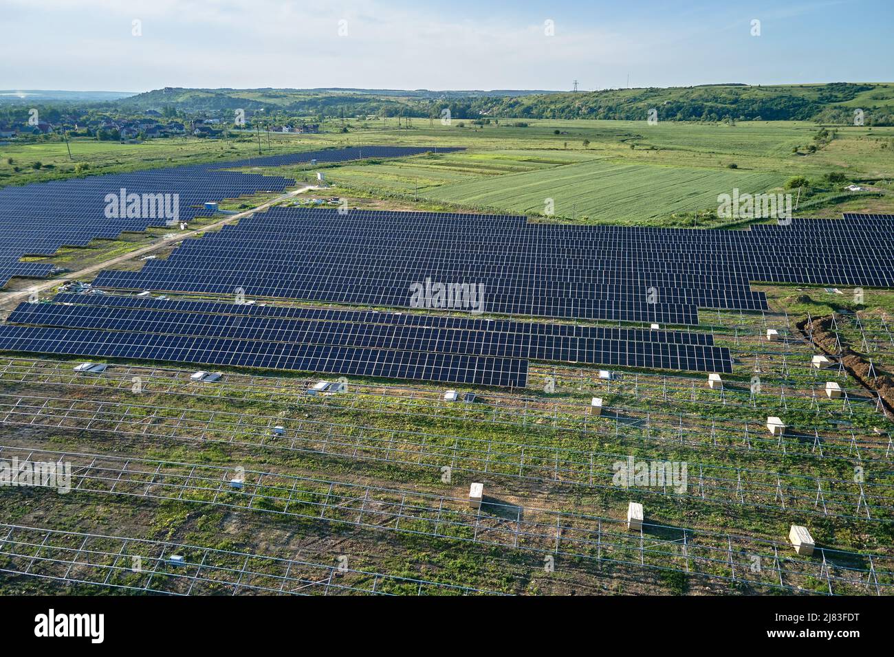 Aerial view of big electric power plant under construction with many ...