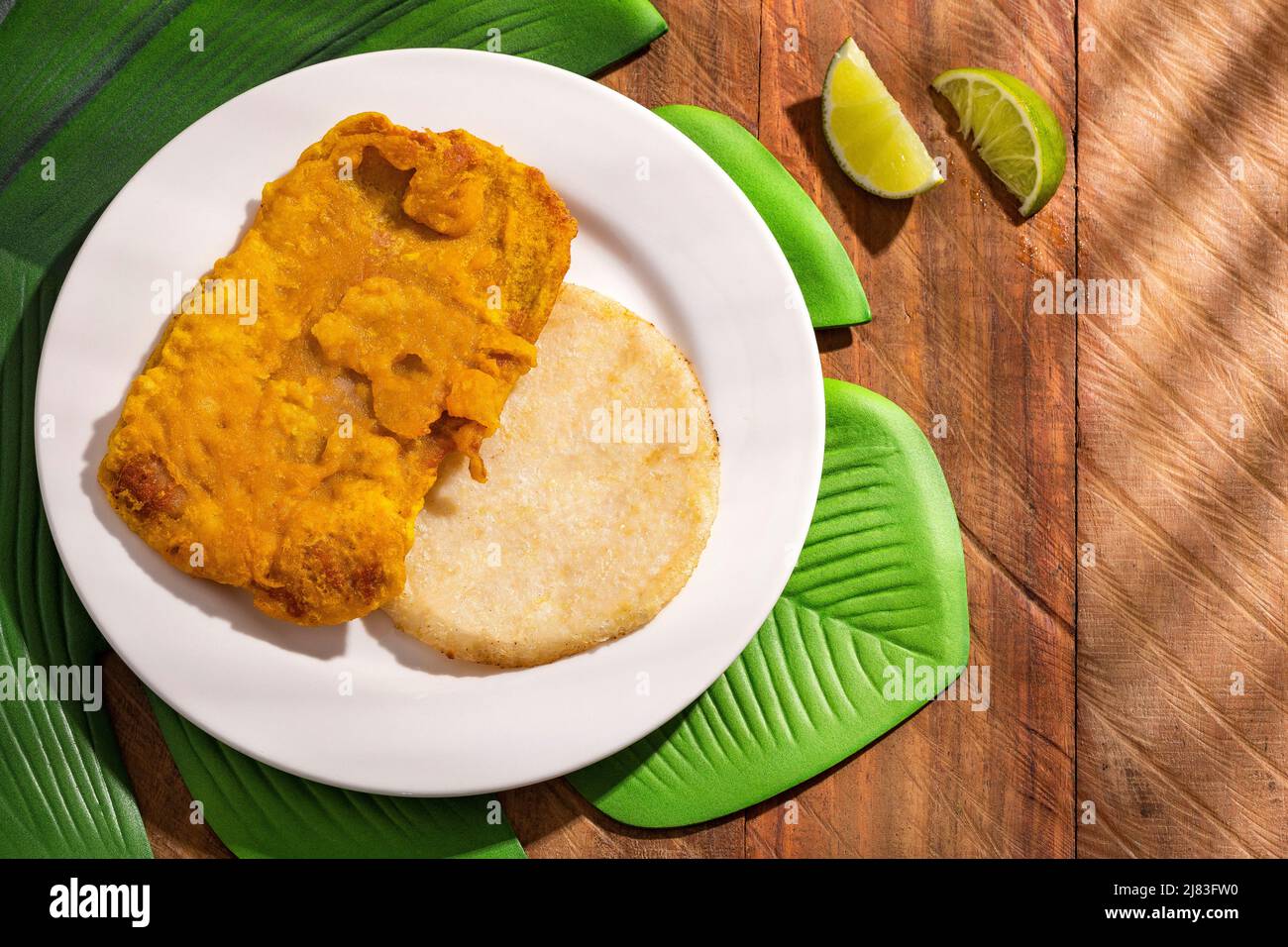 Fish torta with arepa - Colombian street food Stock Photo - Alamy