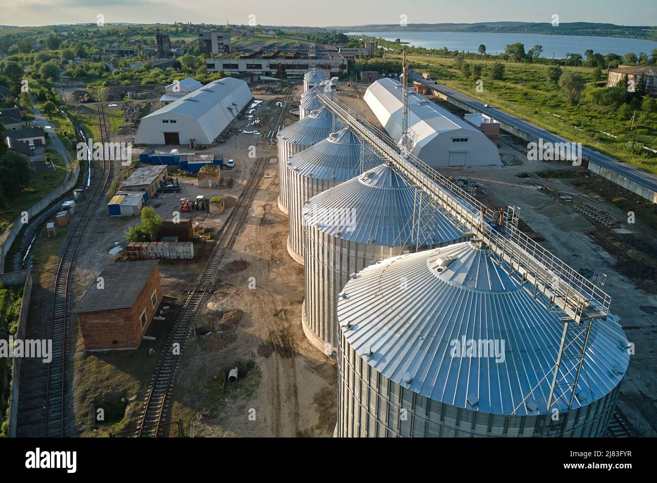Aerial view of industrial ventilated silos for long term storage of grain and oilseed. Metal ...