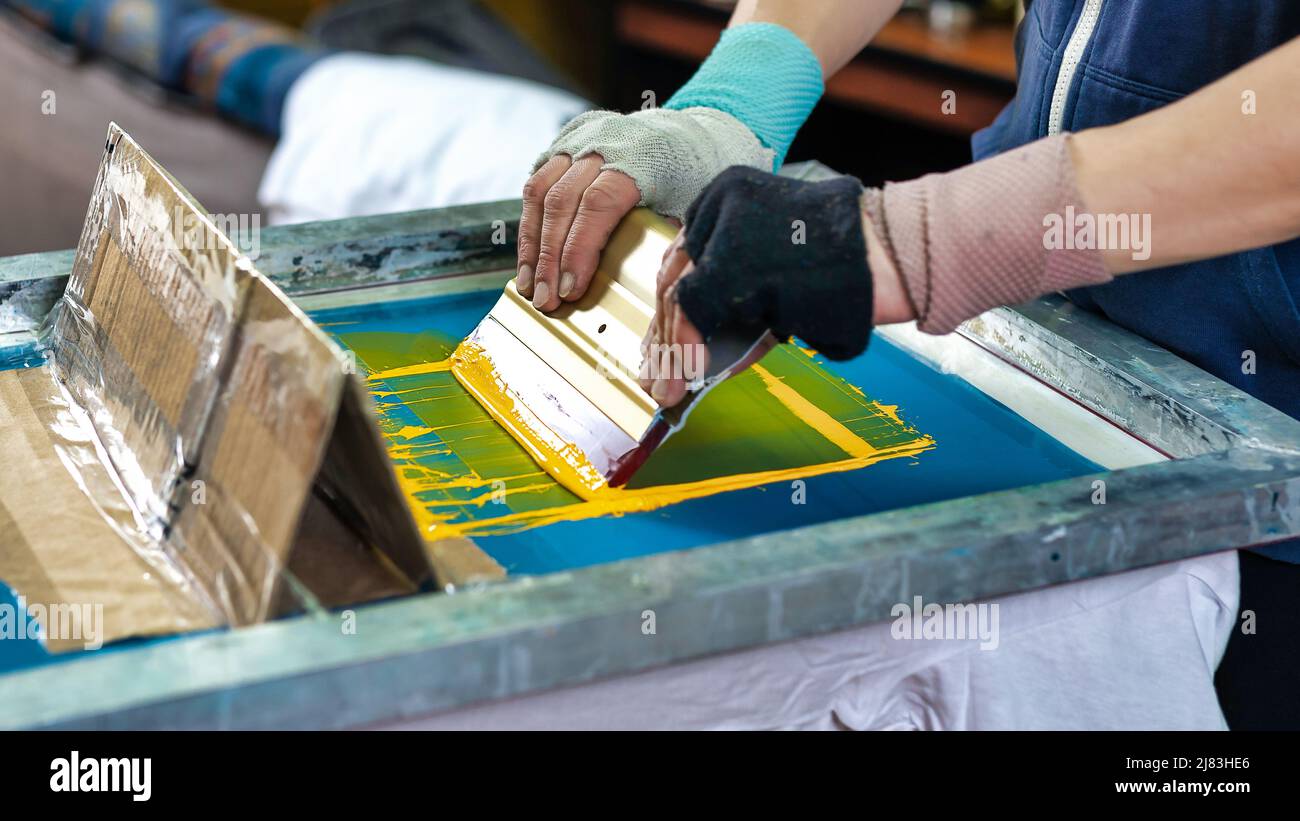 Hand pressing silk screen hi-res stock photography and images - Alamy