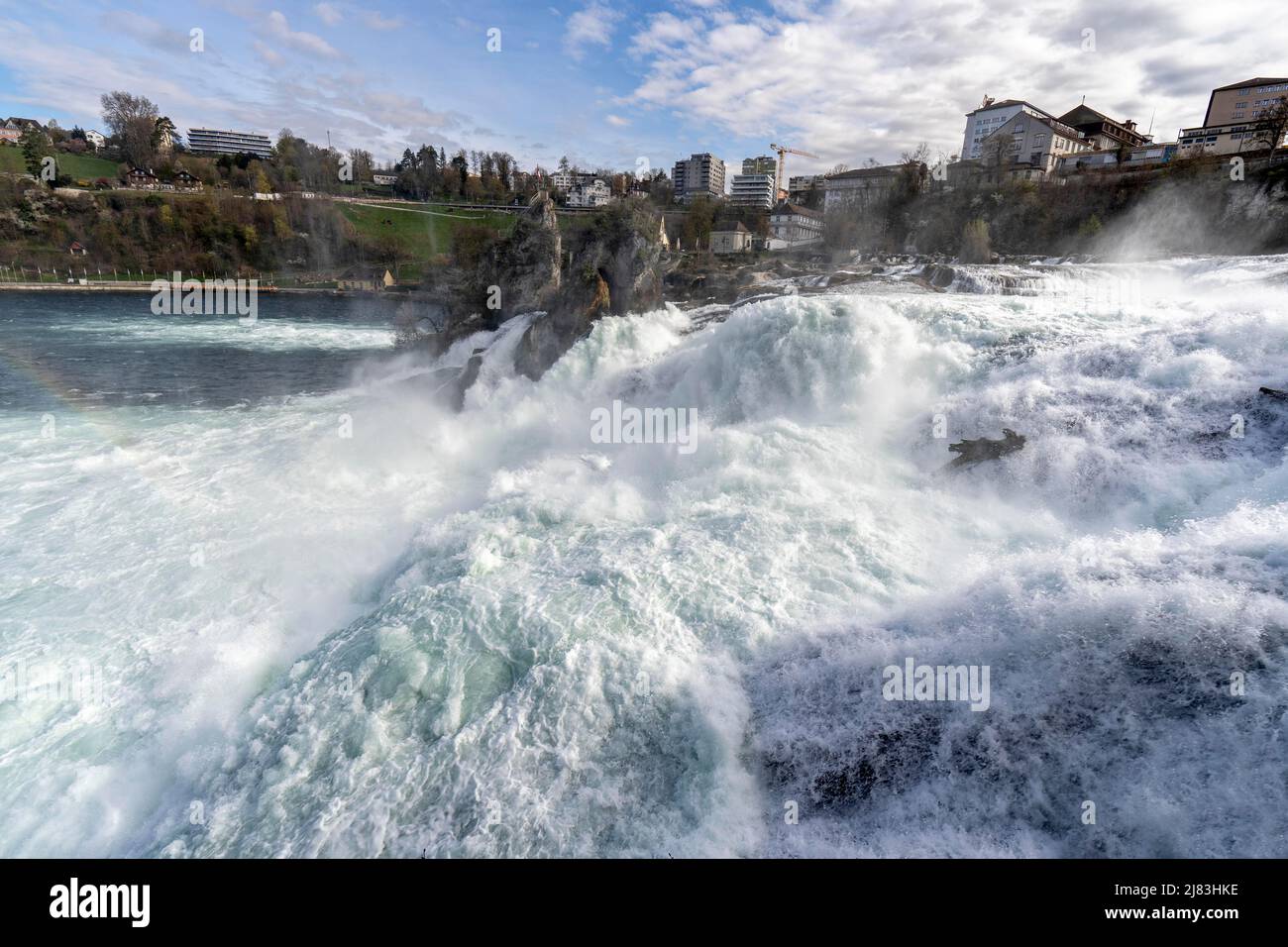 Spray, waves, surf at the Rhine waterfall, Rhine Falls, with a view of ...