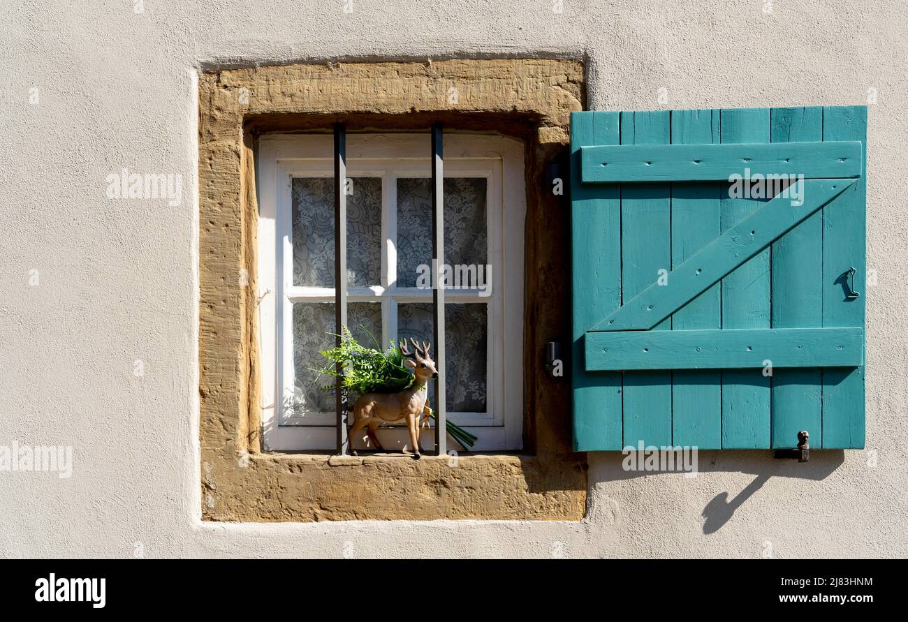 Detail, window with lattice and shutter on a historic half-timbered ...