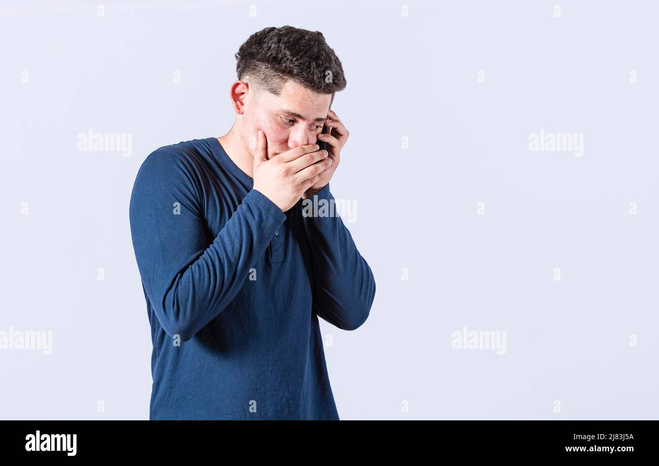 Man secretly talking on the phone, on an isolated background. Man ...