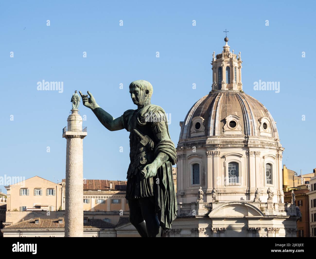 Statue of Emperor Trajan, Trajan's Column at the back, Rome, Latium ...