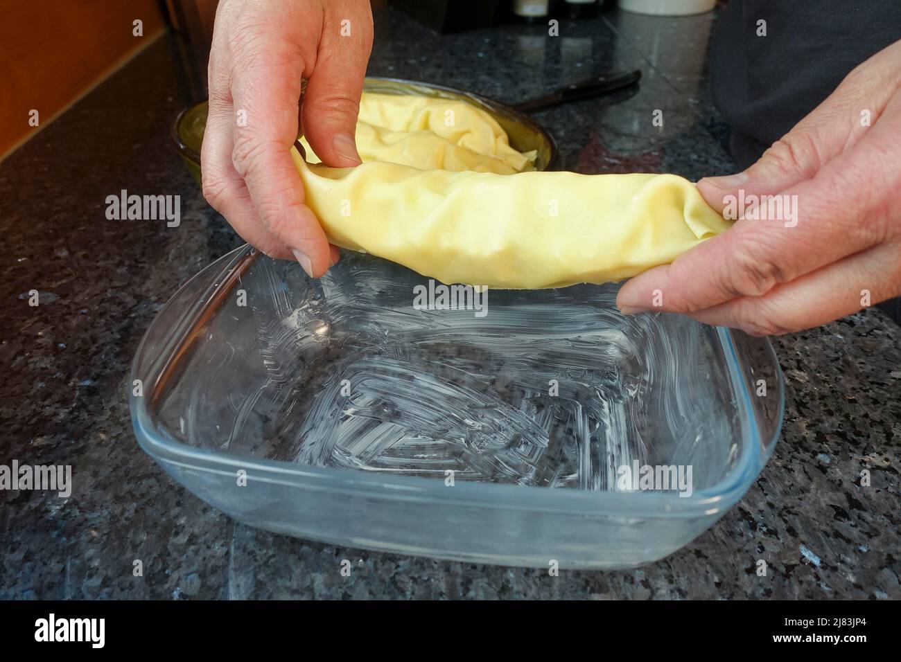 Swabian cuisine, preparing Rutesheim raw strudel, putting filled noodle ...
