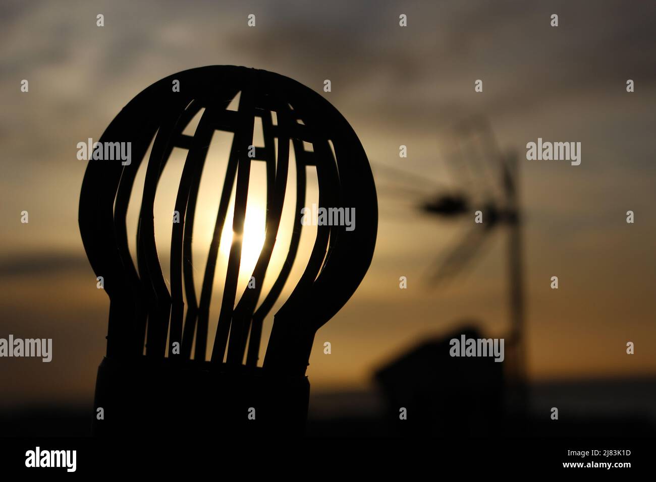light bulb at sunset - concept for bright idea, light going off in ...