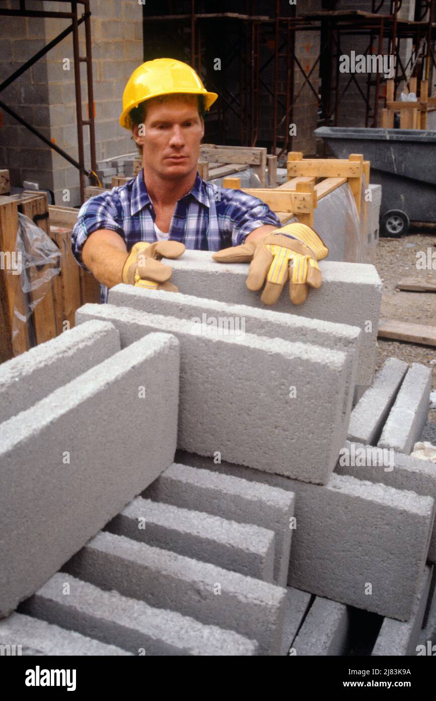 1990s SERIOUS CONSTRUCTION WORKER WEARING HARD HAT HEAVY DUTY GLOVES ...