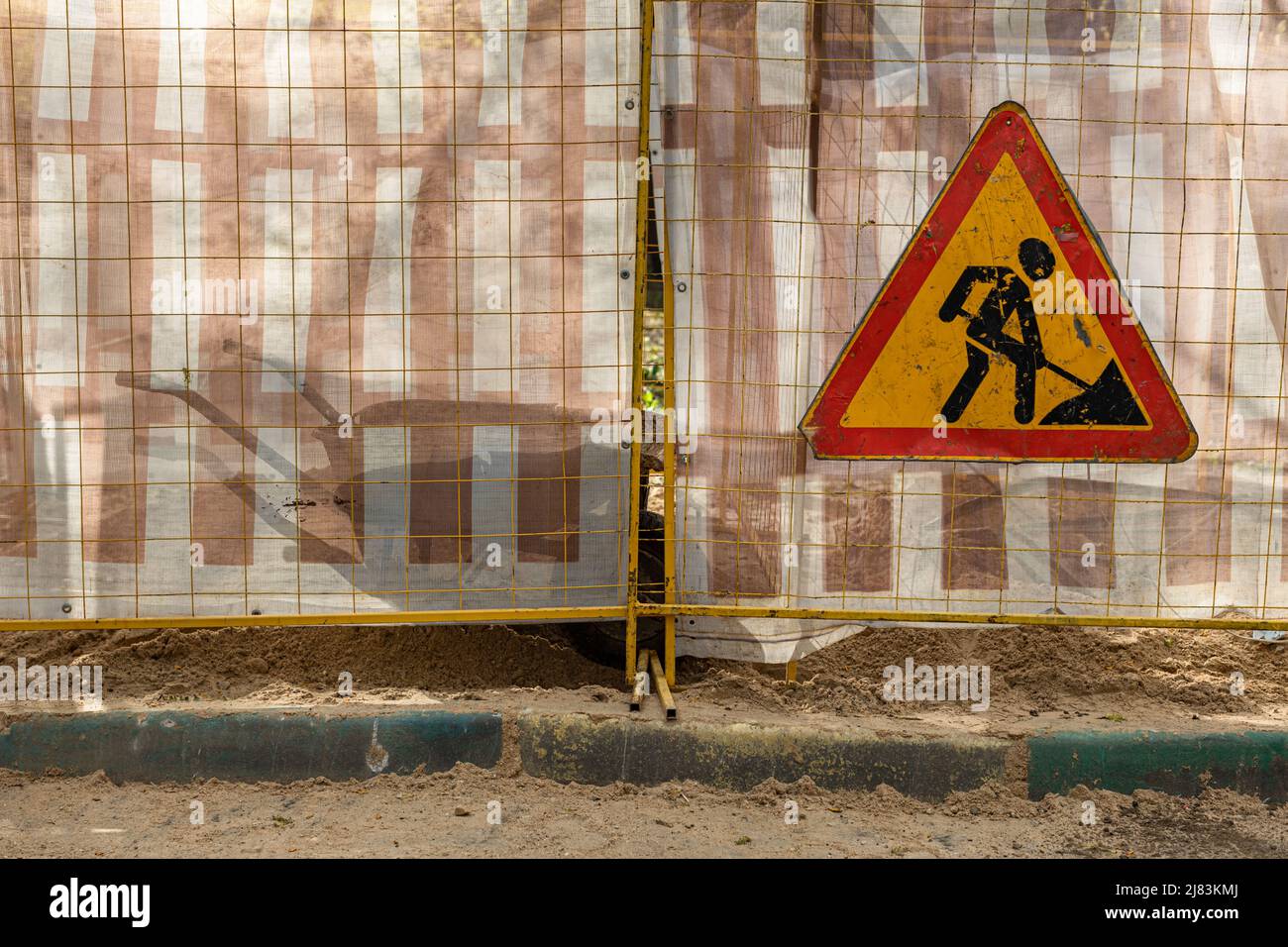 sign warning about the work associated with digging the earth. High ...