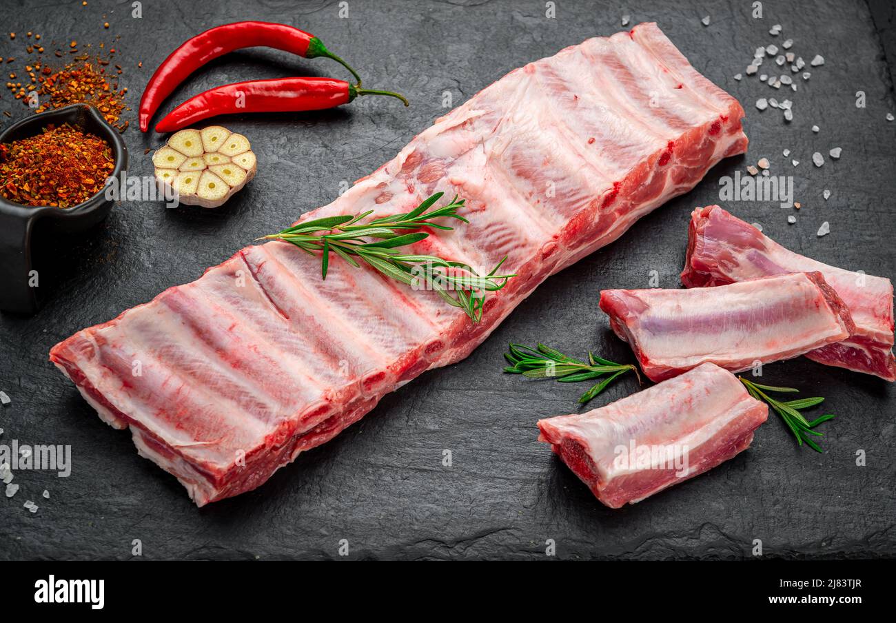 raw pork ribs on a stone background. Fresh pork meat Stock Photo - Alamy