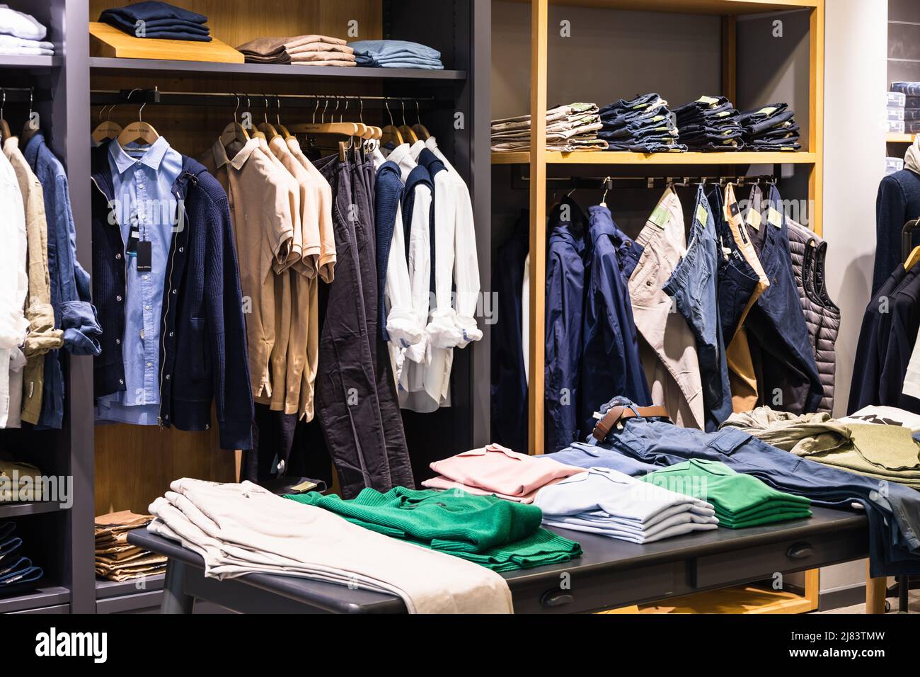 Luxury shopping mall department, clothing store interior. Panorama ...