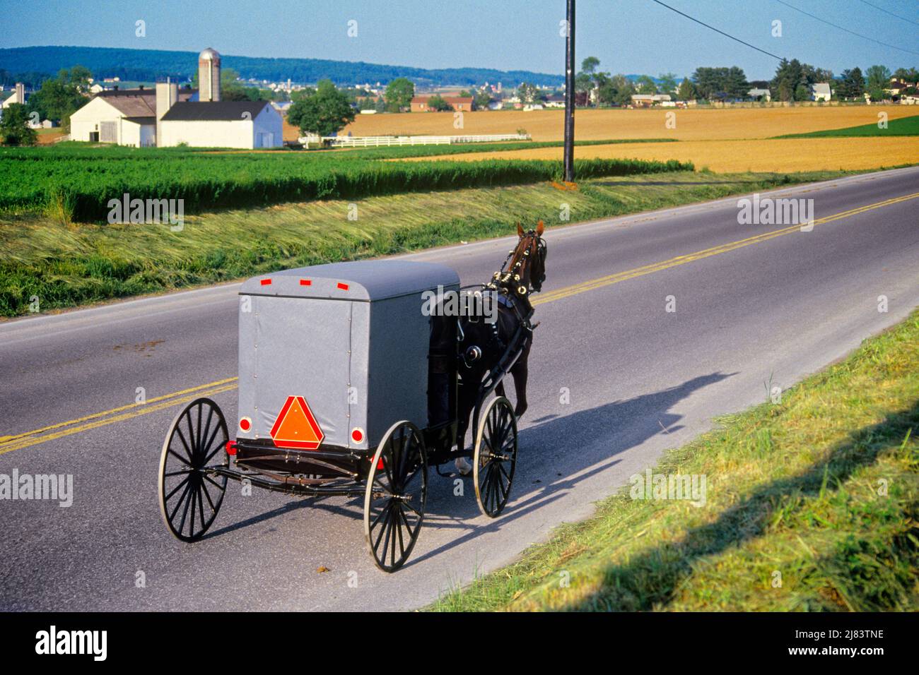 1990s AMISH BUGGY TRAVELS ALONG HIGHWAY LANCASTER COUNTY PENNSYLVANIA ...