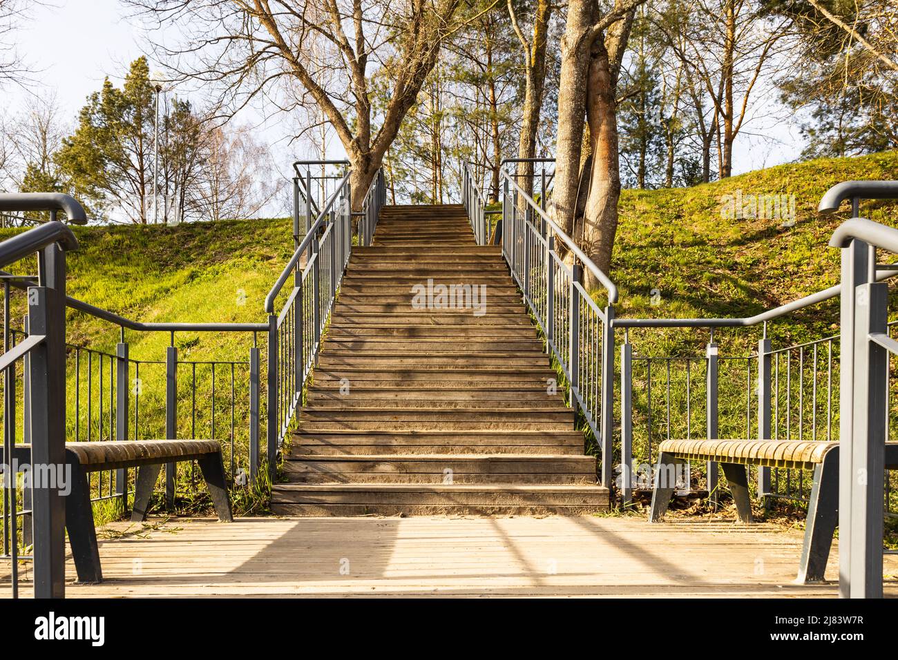 Wooden platform with steel handrails in the city park Stock Photo - Alamy