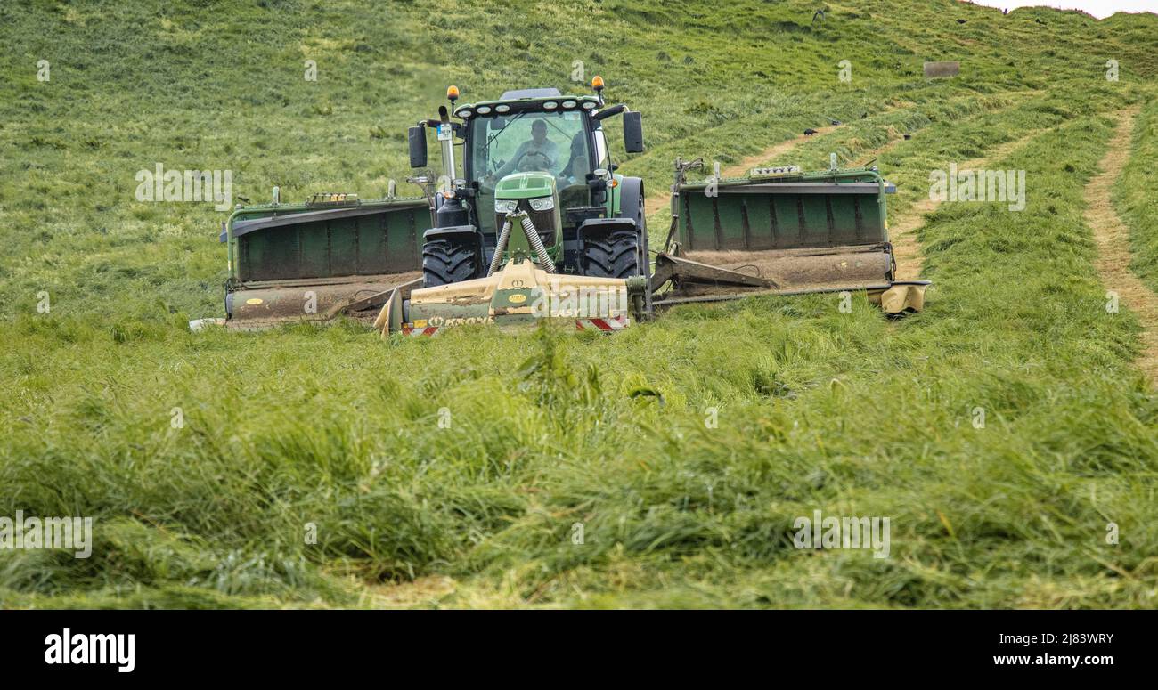 Mowing grass for silage, John Deere 6215R + Krone Mower Stock Photo - Alamy