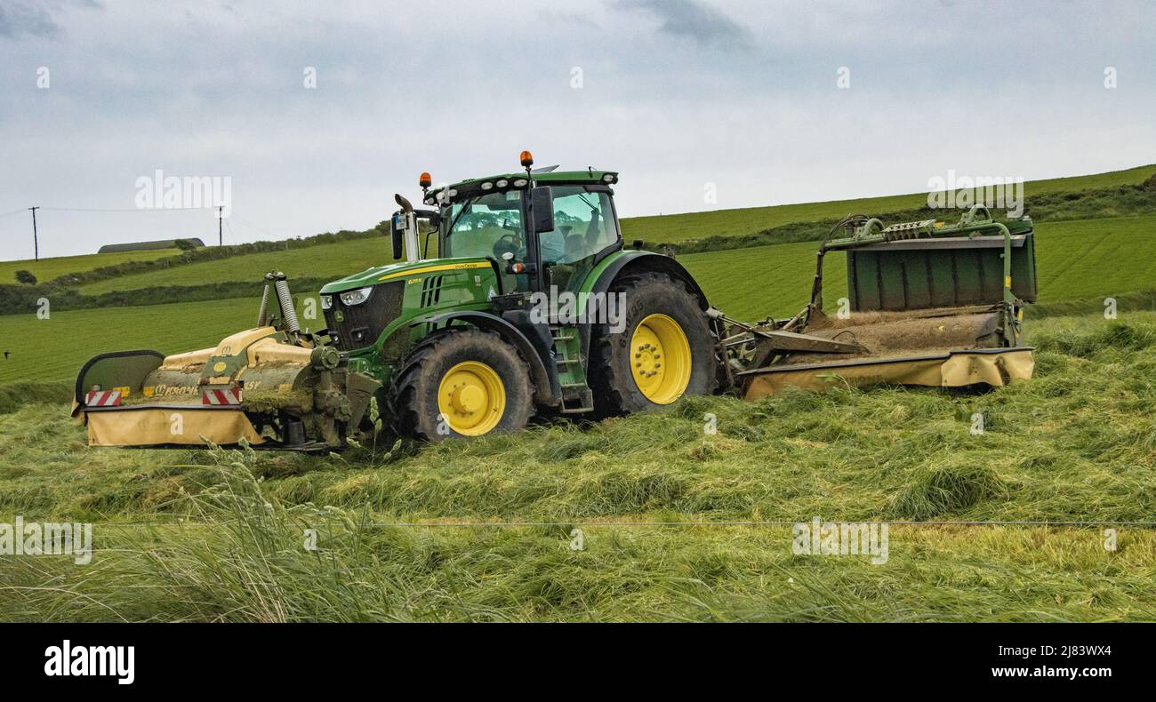 Mowing grass for silage, John Deere 6215R + Krone Mower Stock Photo - Alamy