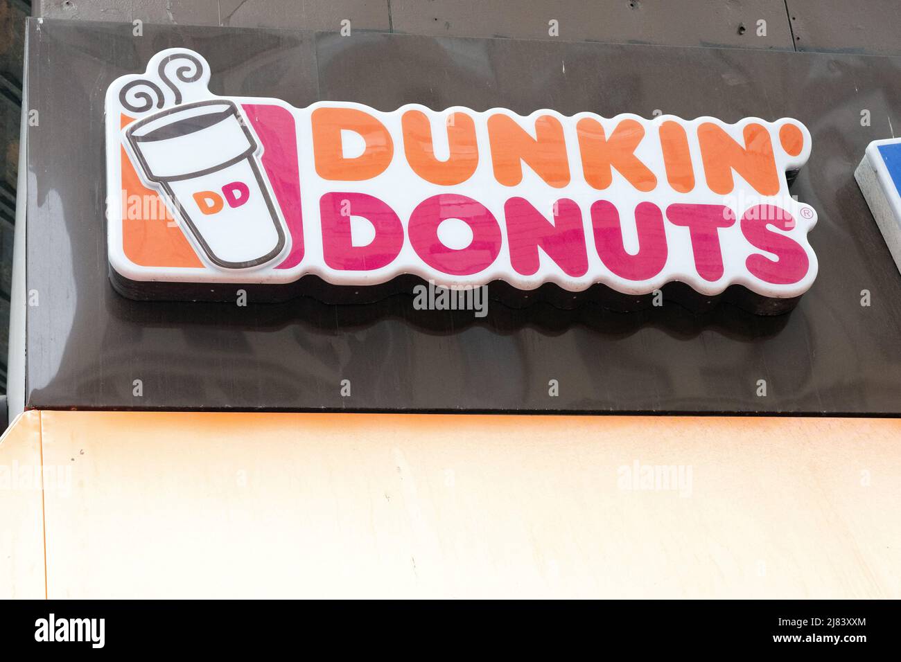 A shop sign of DUNKIN DONUTS, on May 07, 2022 in New-York City, USA ...