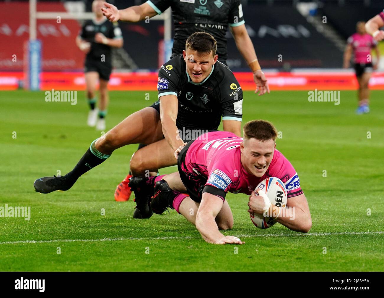 Wigan Warriors' Sam Halsall scores their side's first try of the game ...
