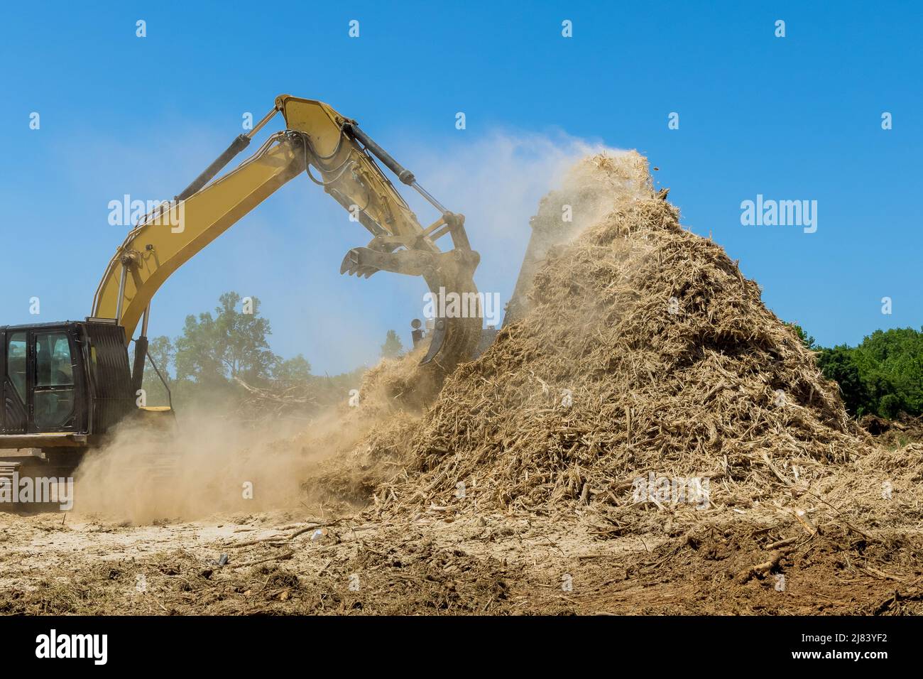 View on wood chipping machine chipper process Stock Photo - Alamy