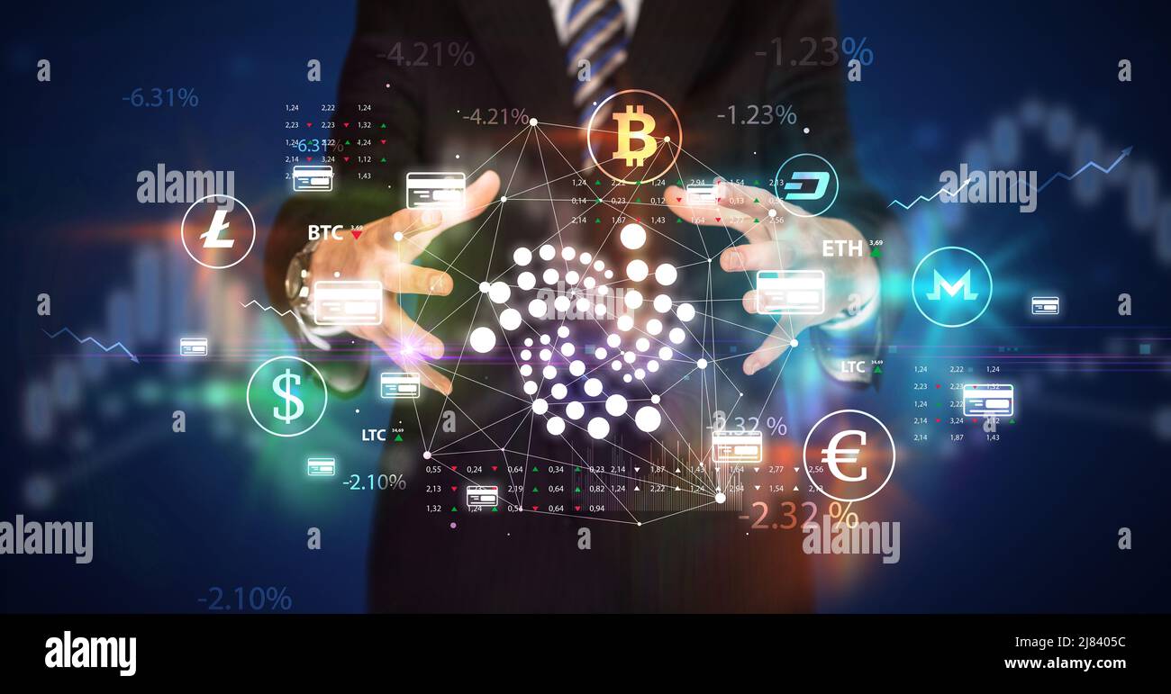 Businessman holding currency symbols concept Stock Photo - Alamy