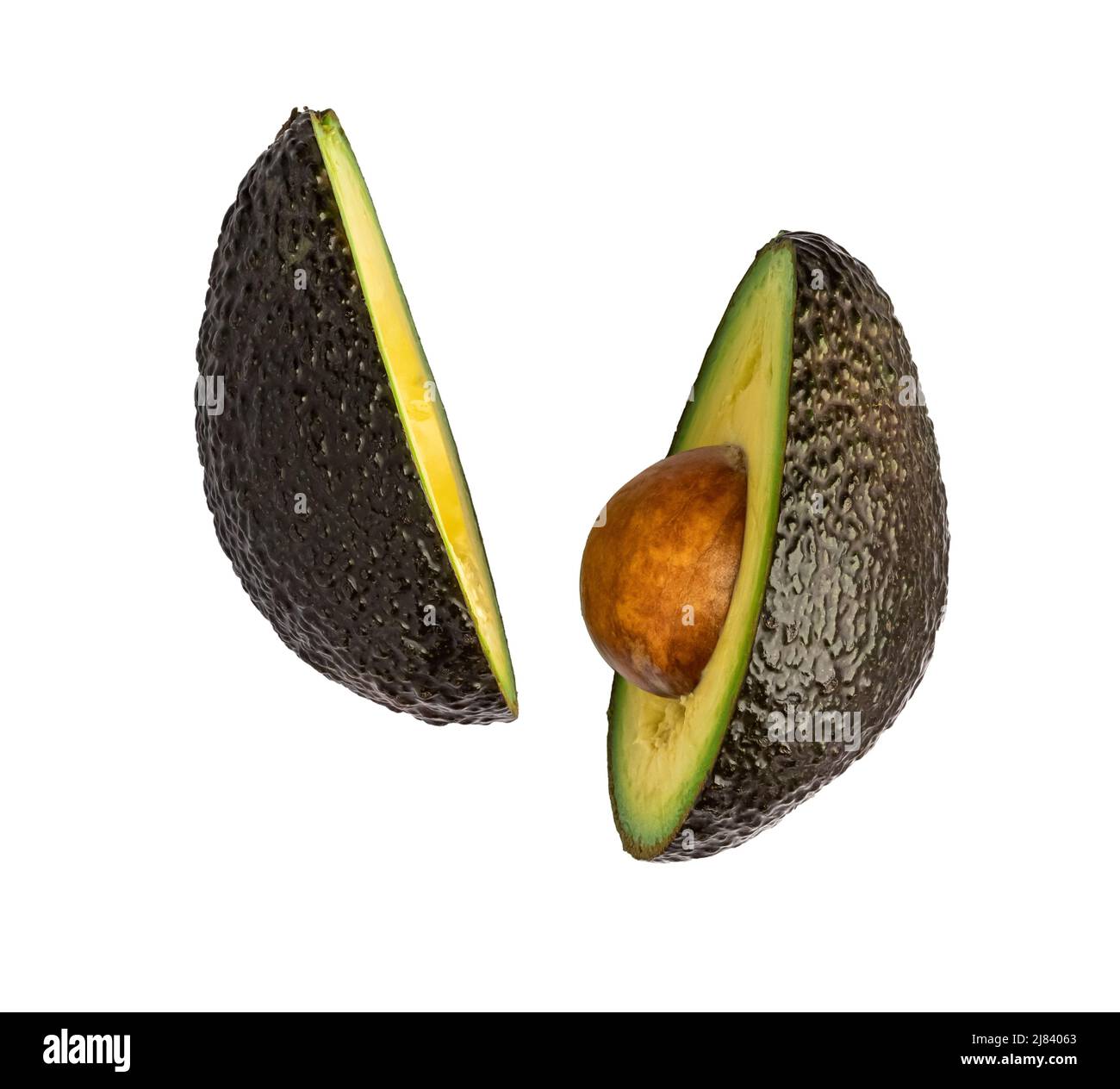 Whole and cut black Avocado Hass isolated on white background Stock ...