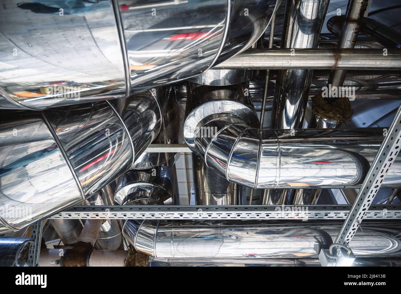 Shiny silver pipeline system and pressure meter at plant Stock Photo ...