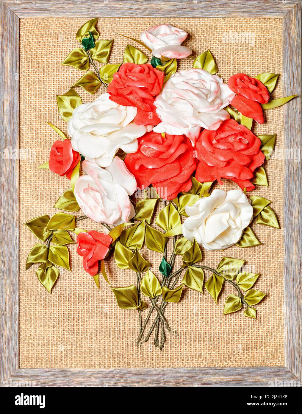 A beautiful and colorful artificial bouquet of red and white roses ...