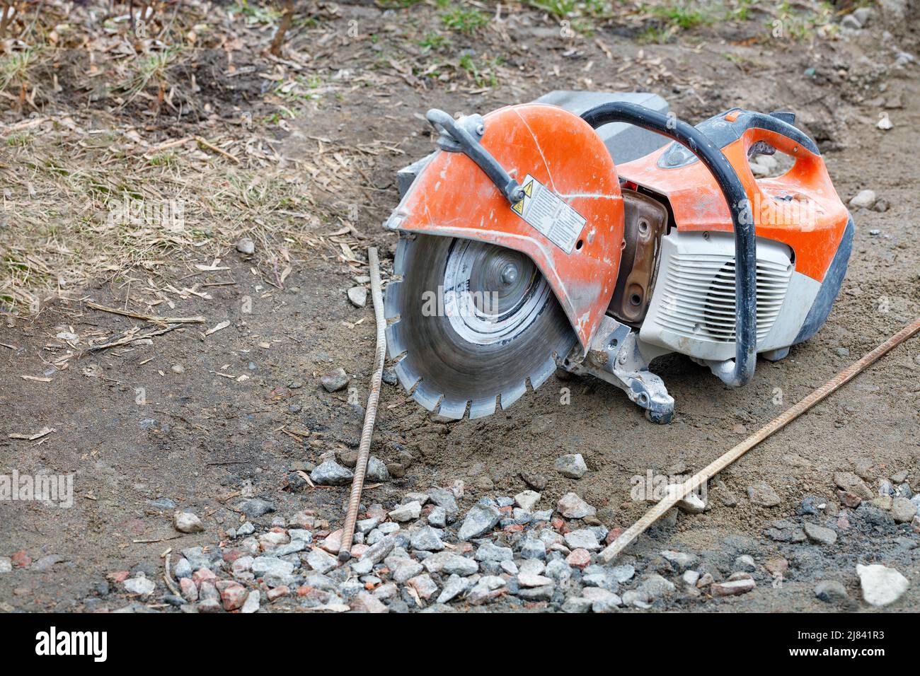 Industrial manual power cutter with a diamond cutting wheel near the ...