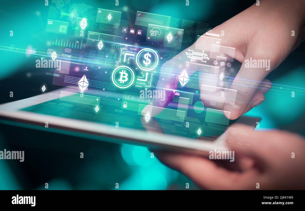 Close-up of a hand using tablet, currency concept Stock Photo - Alamy