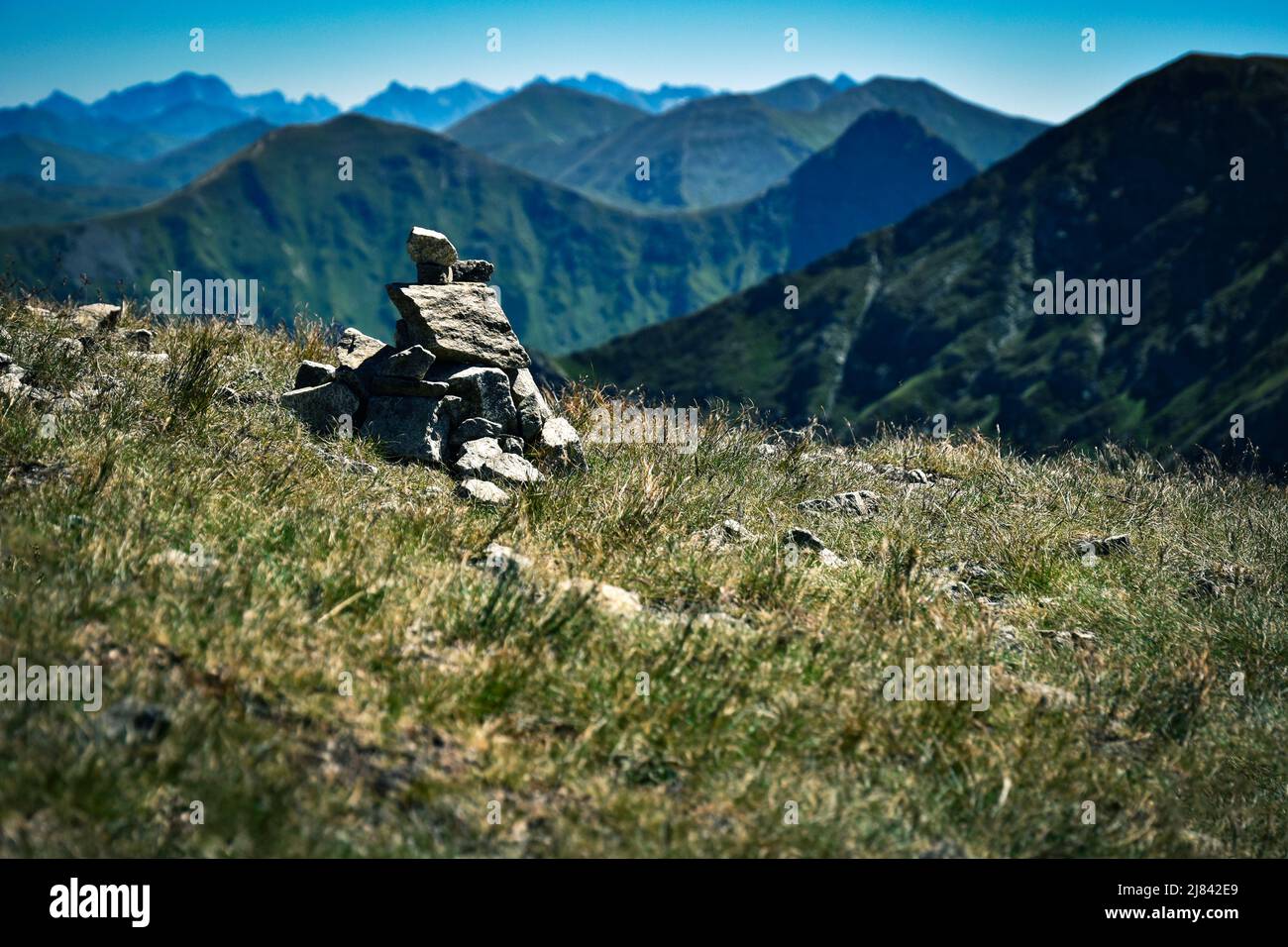 landscape background a stone man in the mountains Stock Photo - Alamy
