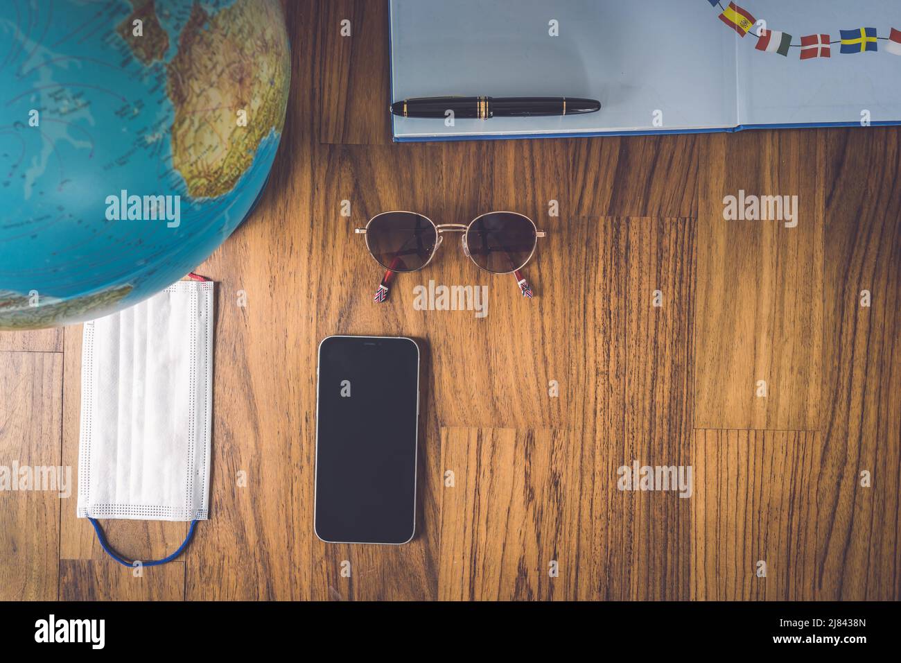 World map and items on wooden background, flat lay. summer travel ...