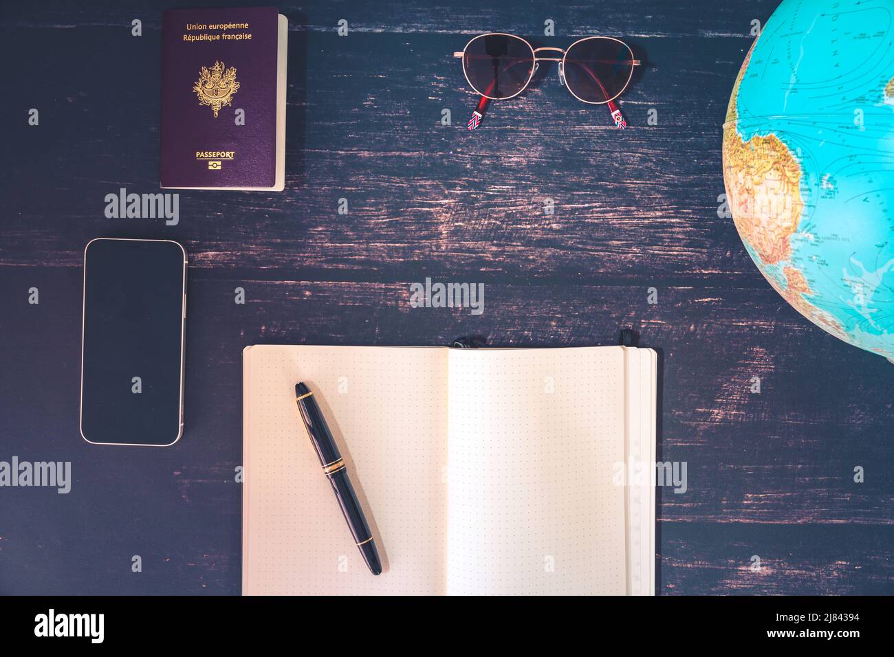 World map and items on wooden background, flat lay. summer travel ...