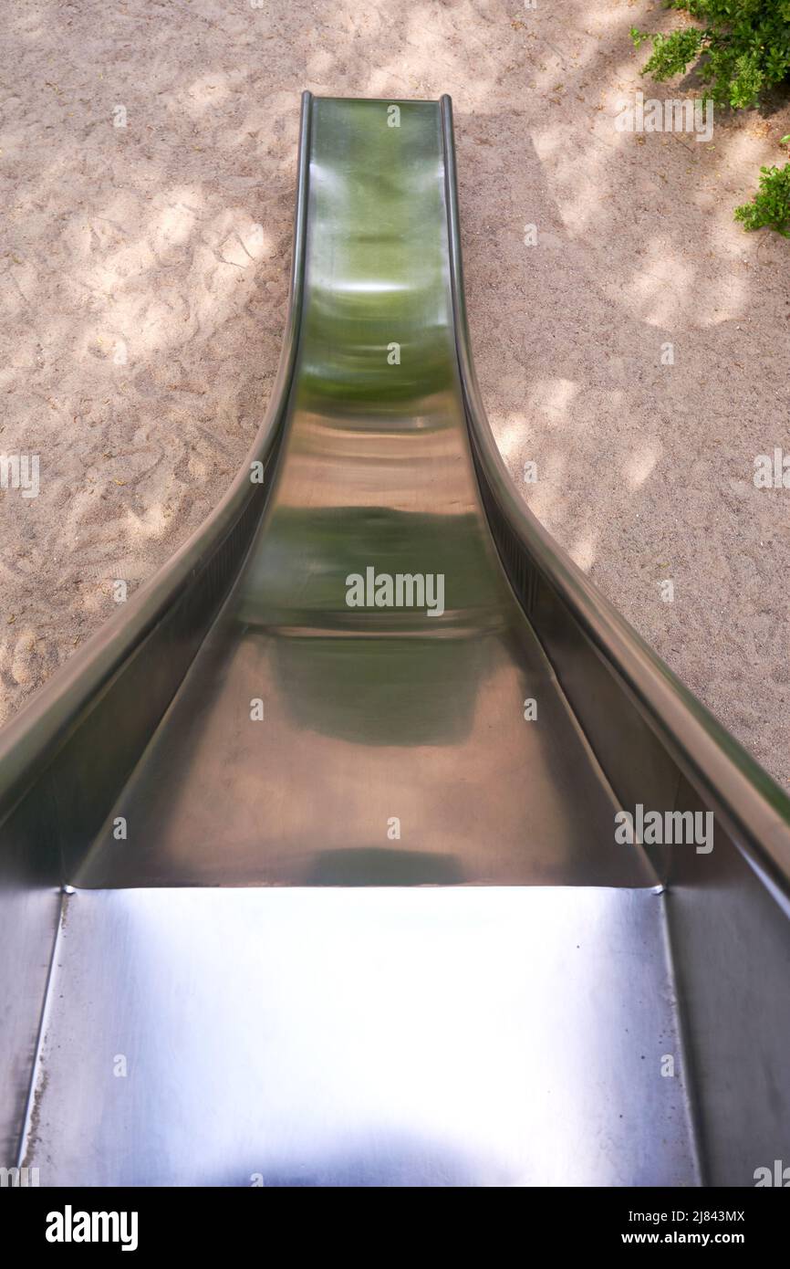empty metal slide on playground Stock Photo - Alamy