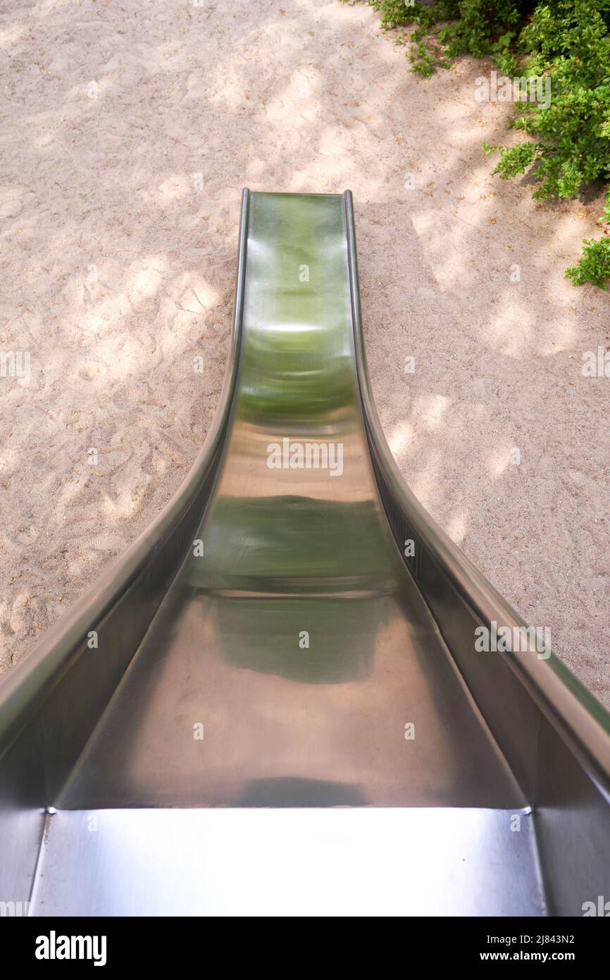 empty metal slide on playground Stock Photo - Alamy