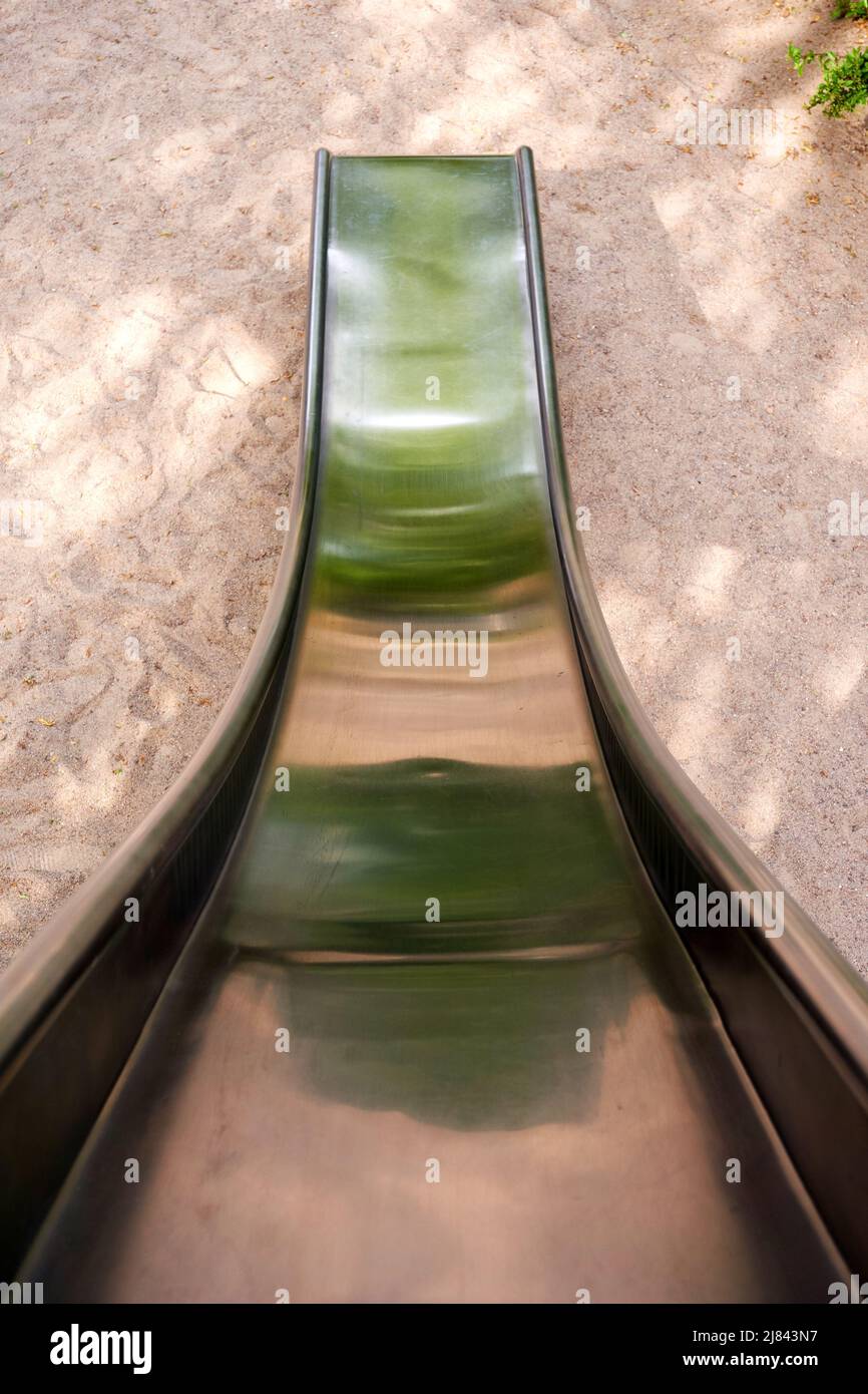 Empty playground metal slide hi-res stock photography and images - Alamy