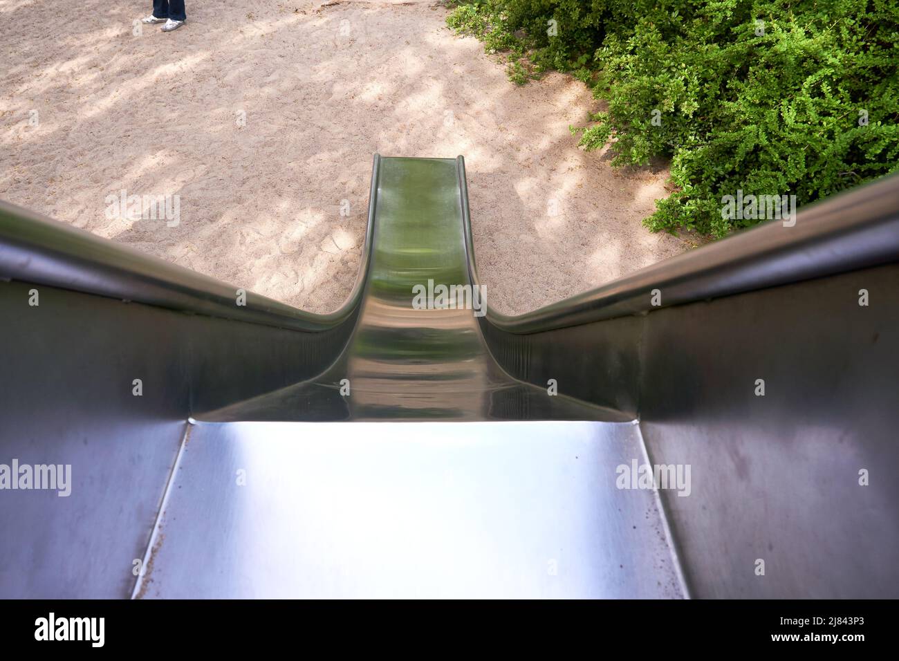 empty metal slide on playground Stock Photo - Alamy