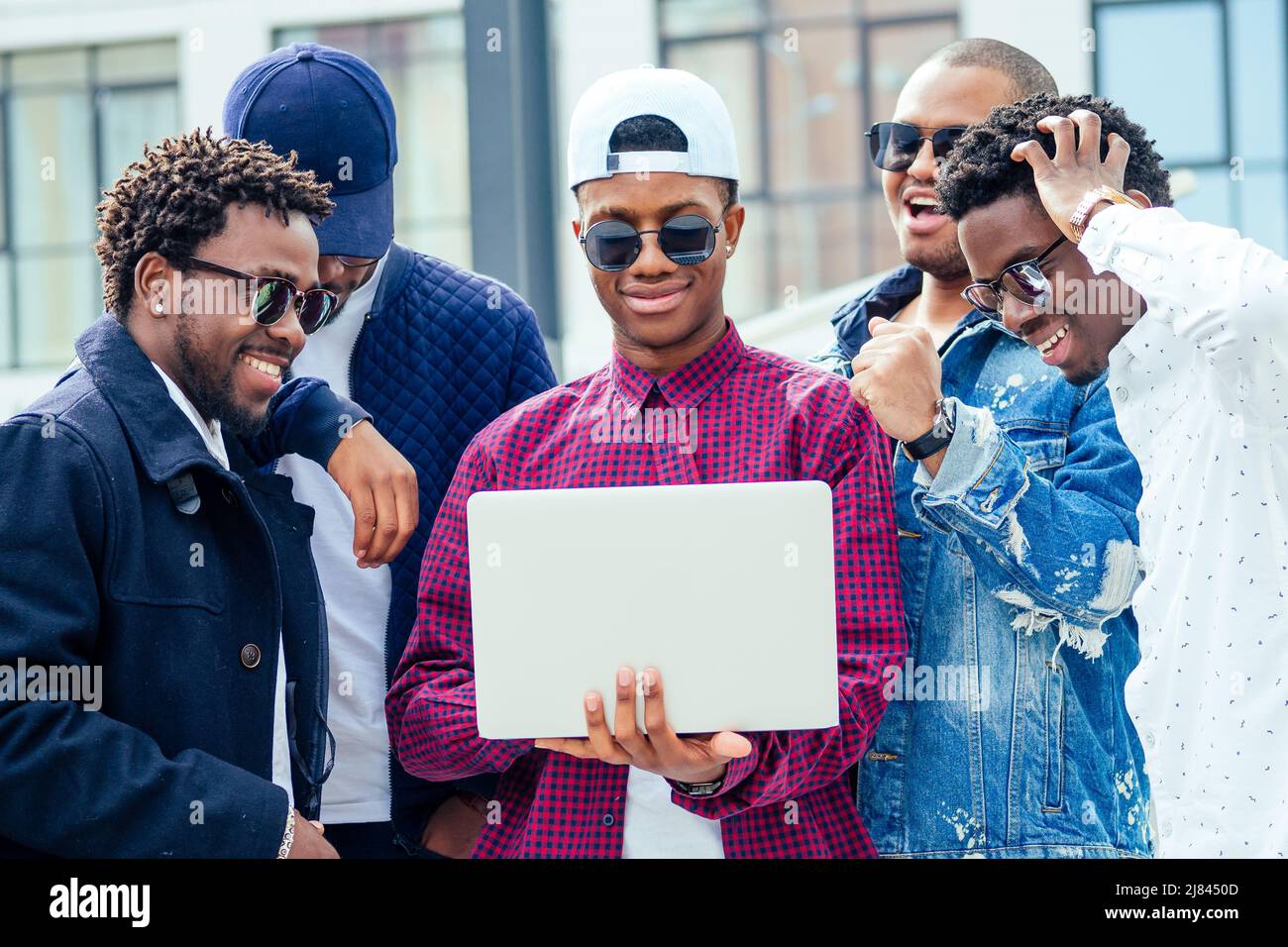 friends studying and networking, sitting together working laptop on ...