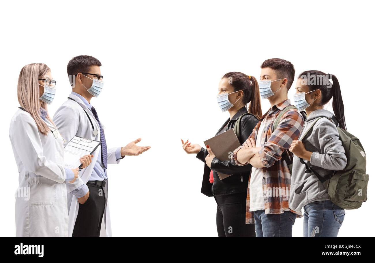 Doctors with medical masks talking to a group of students isolated on ...