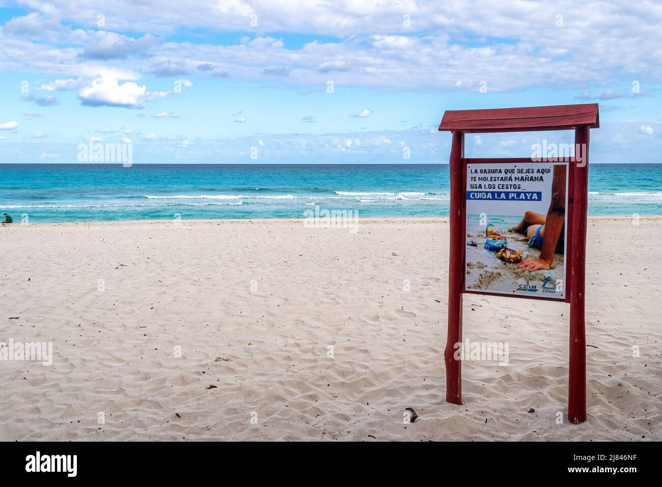 A sign in the white sands of Varadero beach promoting the cleanliness ...