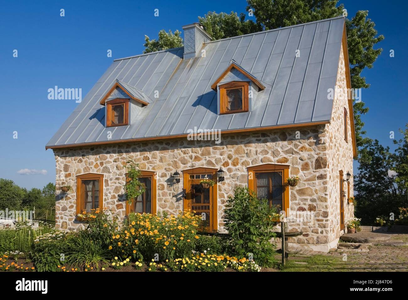 Replica of old 1700s French regime cottage style fieldstone home with ...