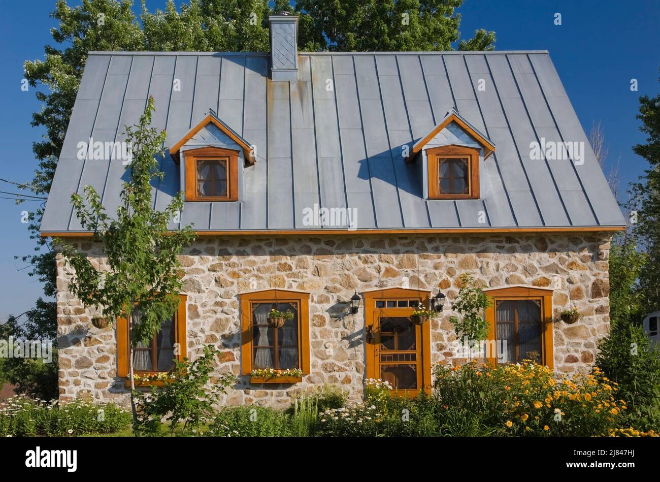 Replica of old 1700s French regime cottage style fieldstone home with ...